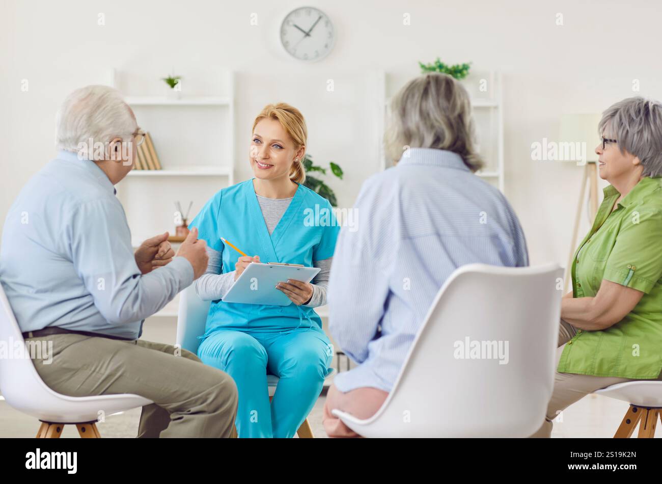 Senior people group circle talk therapy assisted living exercise and ...