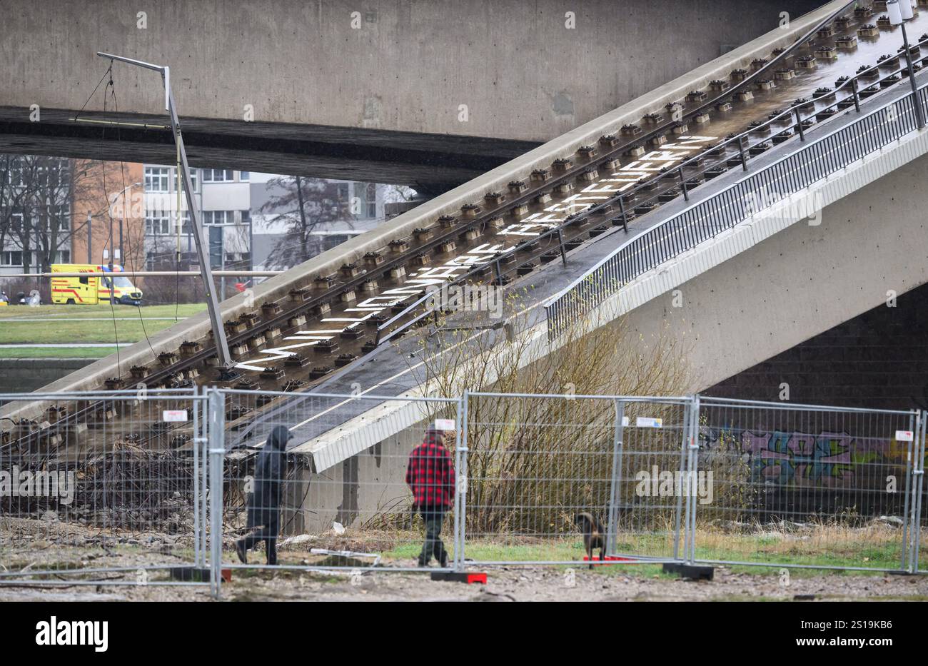 Dresden, Germany. 02nd Jan, 2025. People walk along the banks of the ...