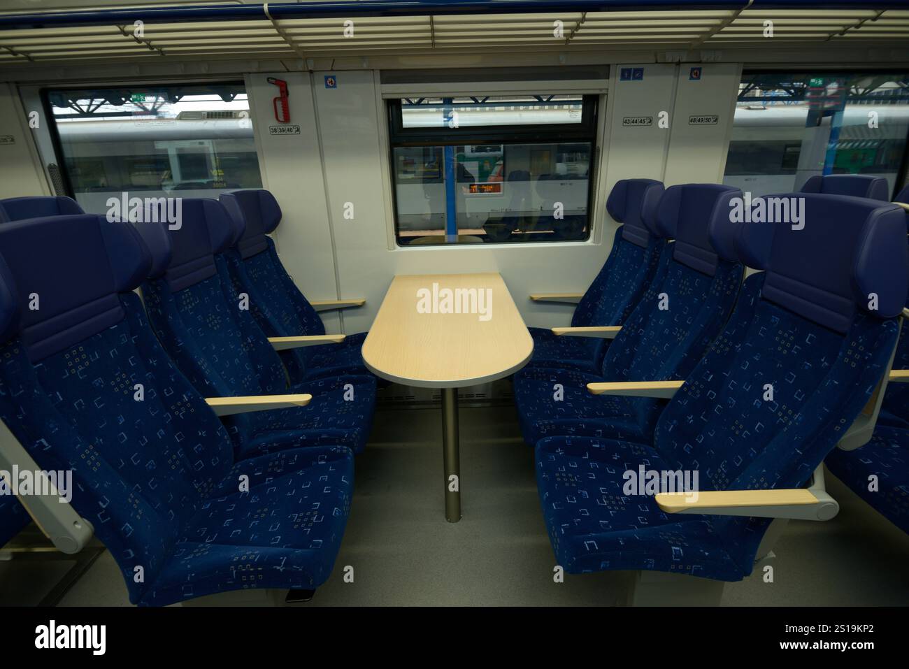 2 class compartment of the wagon of commuter train, seats and doors ...