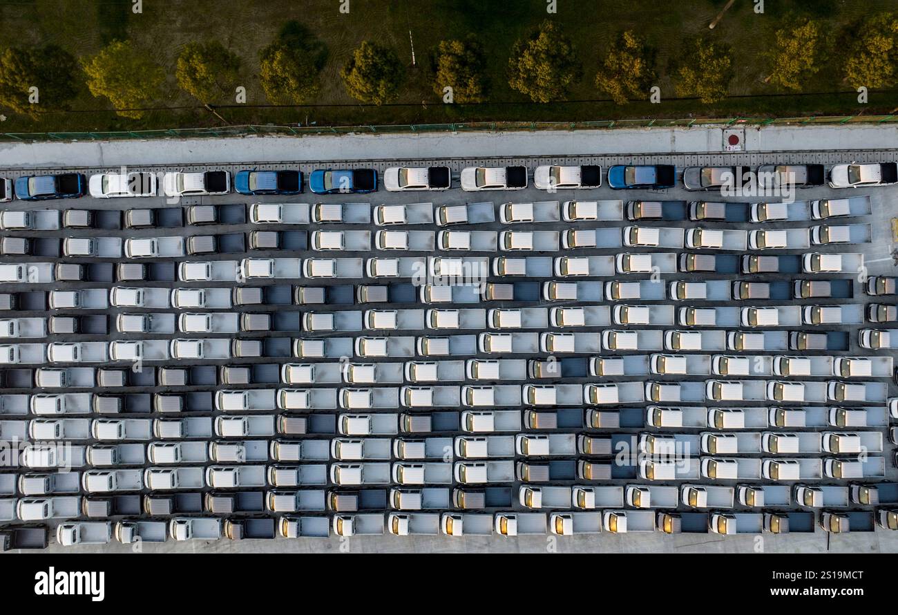 Aerial view of new vehicles waiting for shipment in a port in Taicang ...