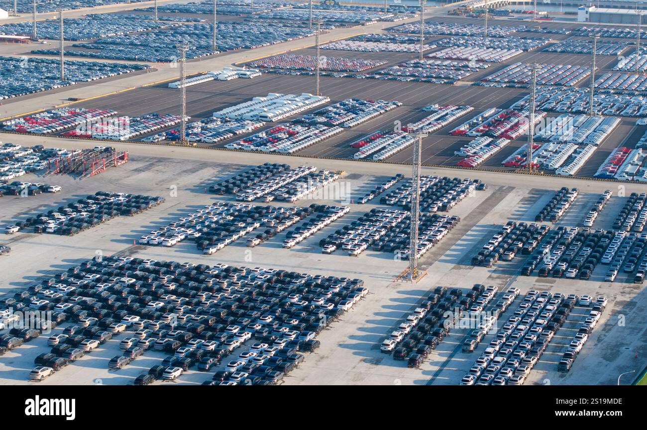 Aerial view of new vehicles waiting for shipment in a port in Taicang ...