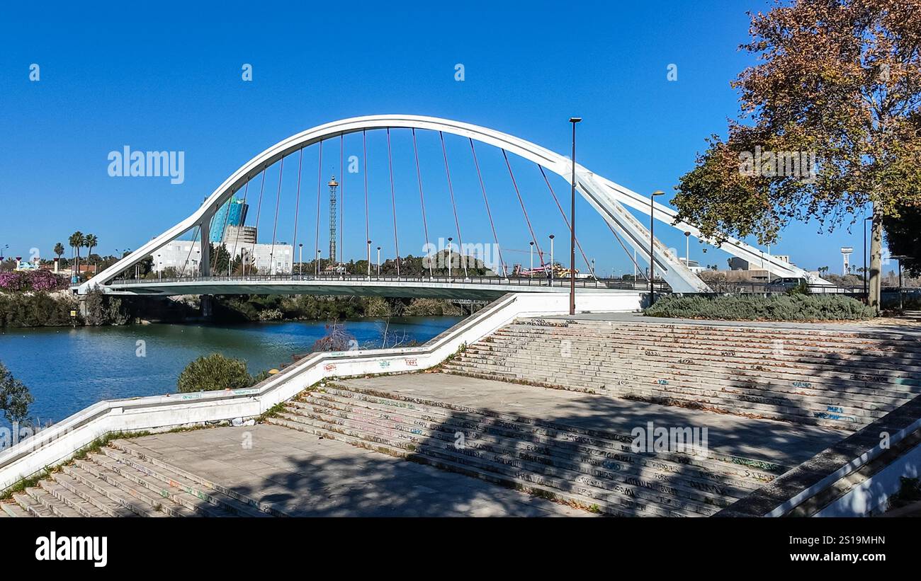 The sleek Puente de la Barqueta bridge, built in 1992, spans a channel ...