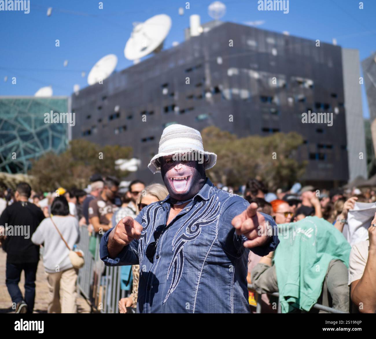 A fan dons a monkey mask in reference to Williams' character in "Better ...