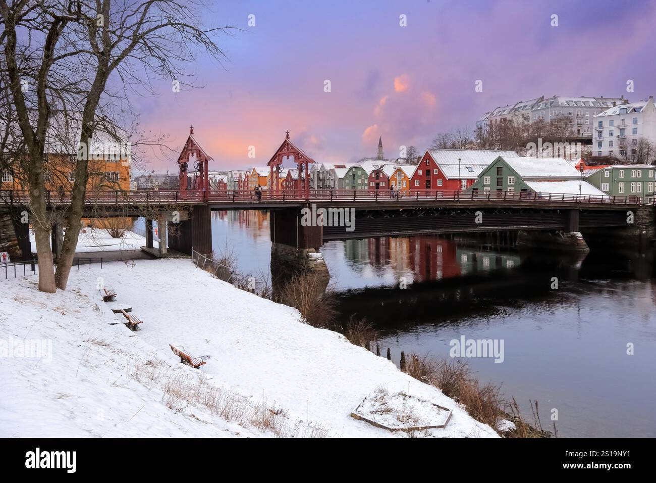 River Nidelva and The Old Bridge in Trondheim, covered with snow after ...