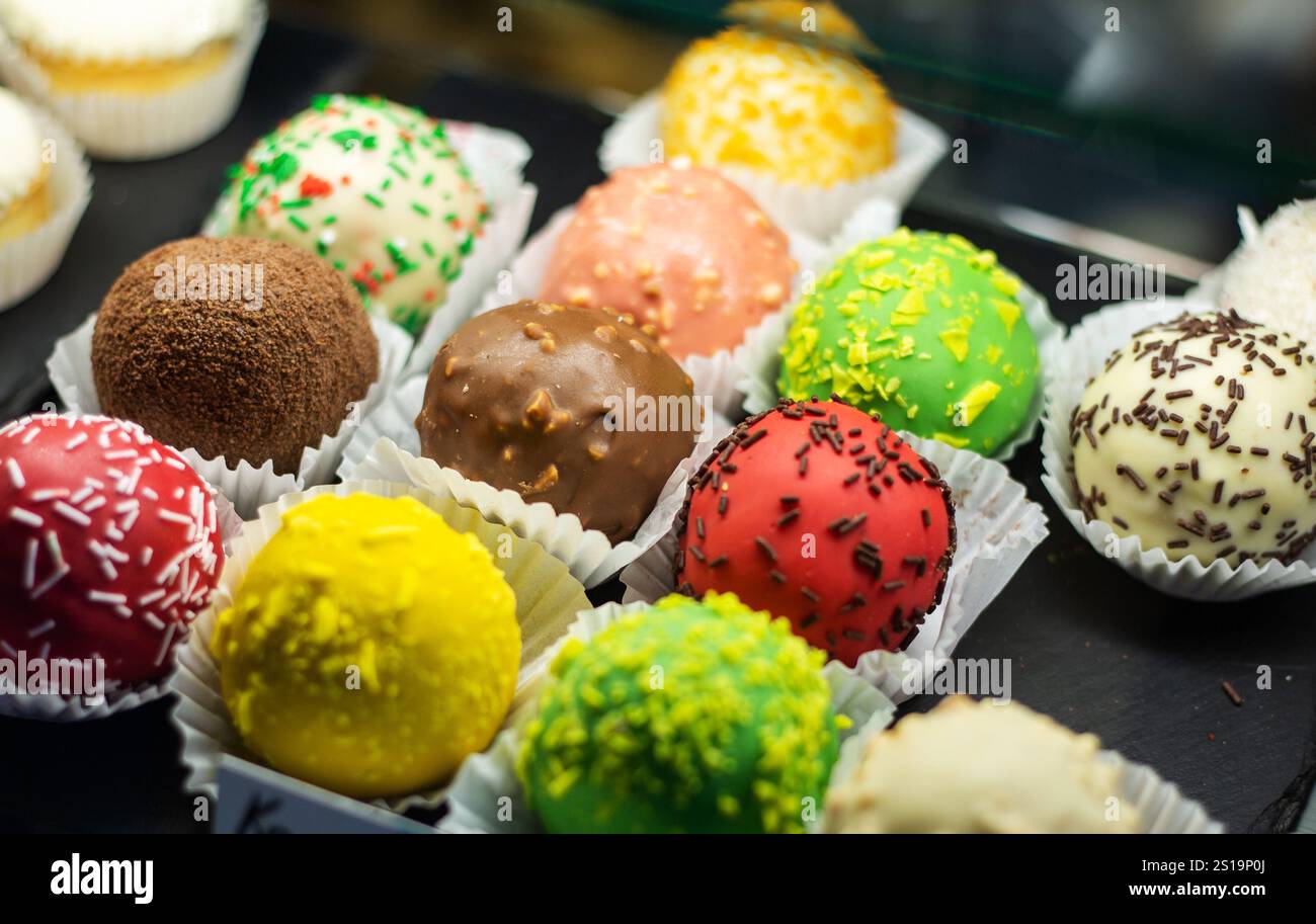 Colorful cakes on display in a shop Stock Photo - Alamy
