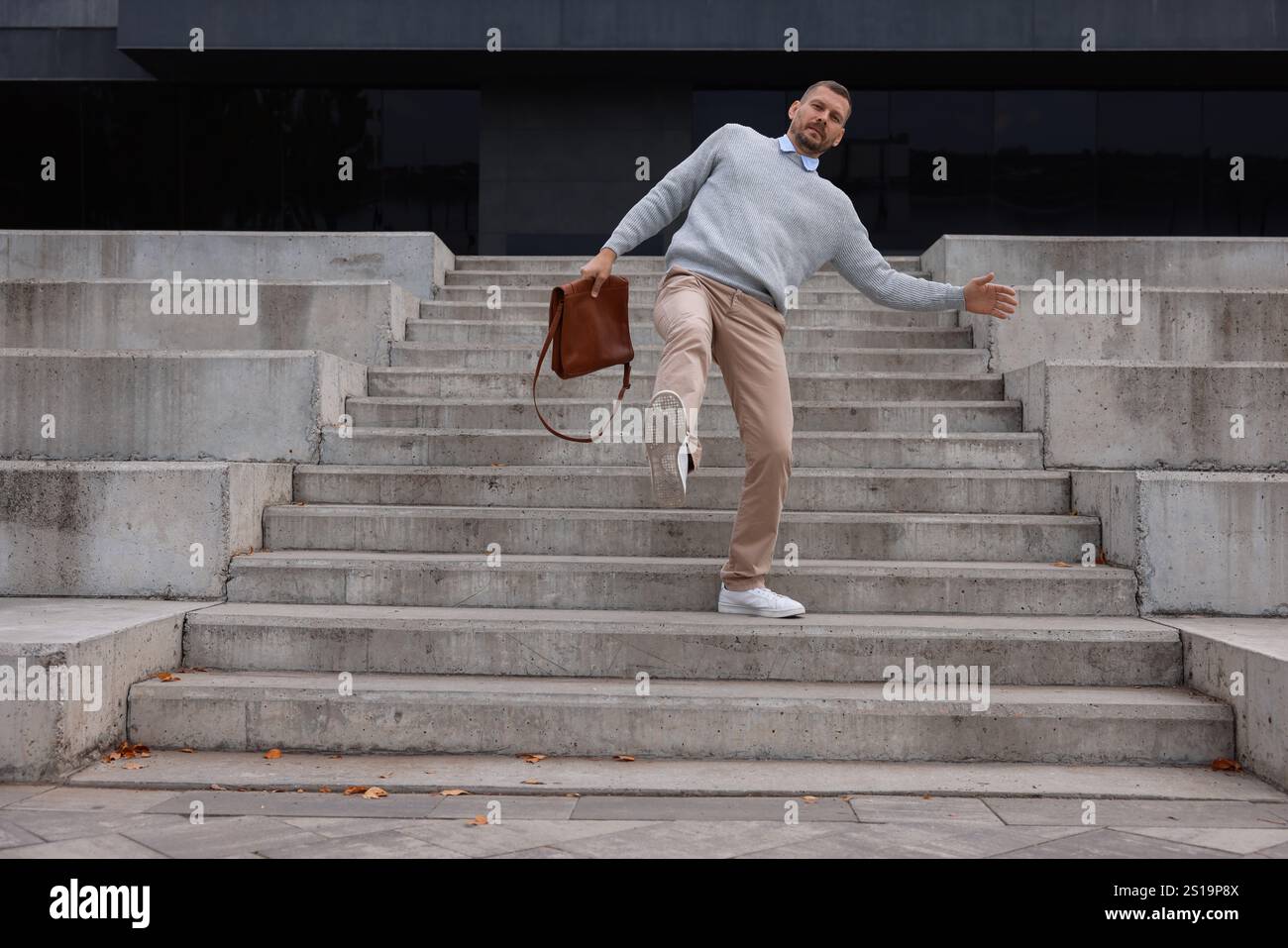 Man falling on stairs outdoors. Dangerous accident Stock Photo - Alamy