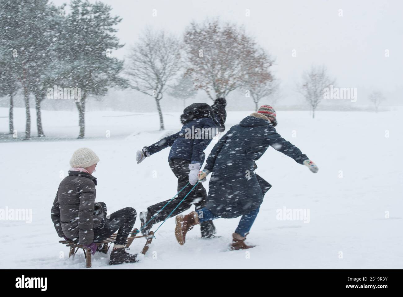 UK weather. A family sledging in heavy snow in Aberdeen Scotland Jan ...