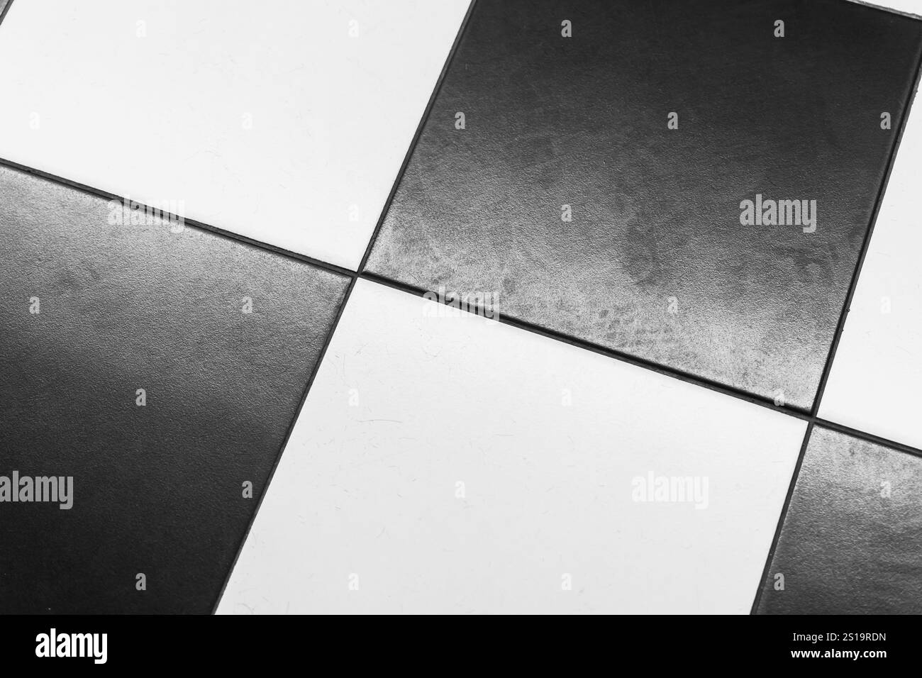 Black and white checkerboard floor pattern in a modern interior space ...