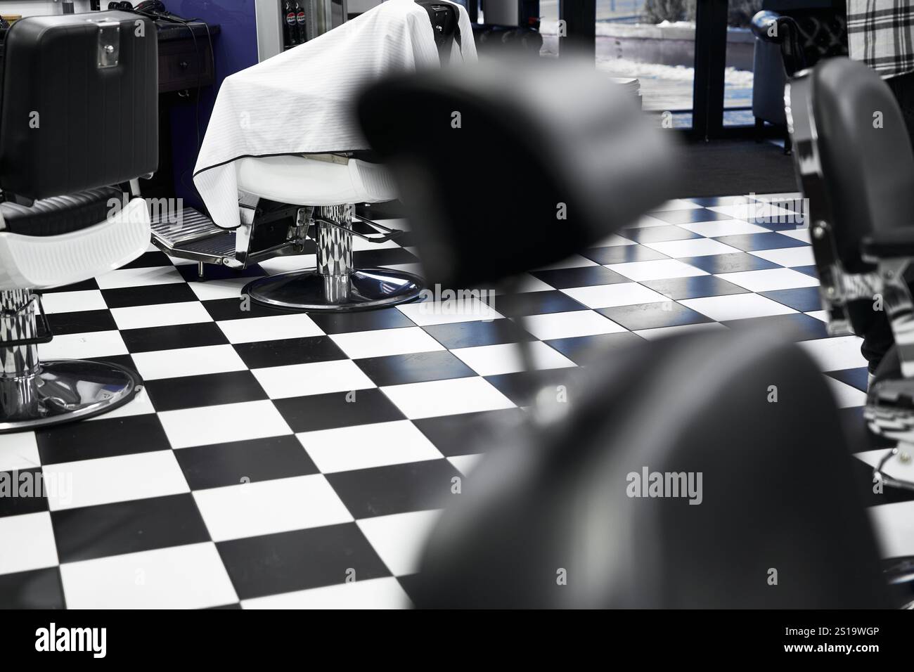 Modern barbershop interior with black and white checkered floor Stock ...