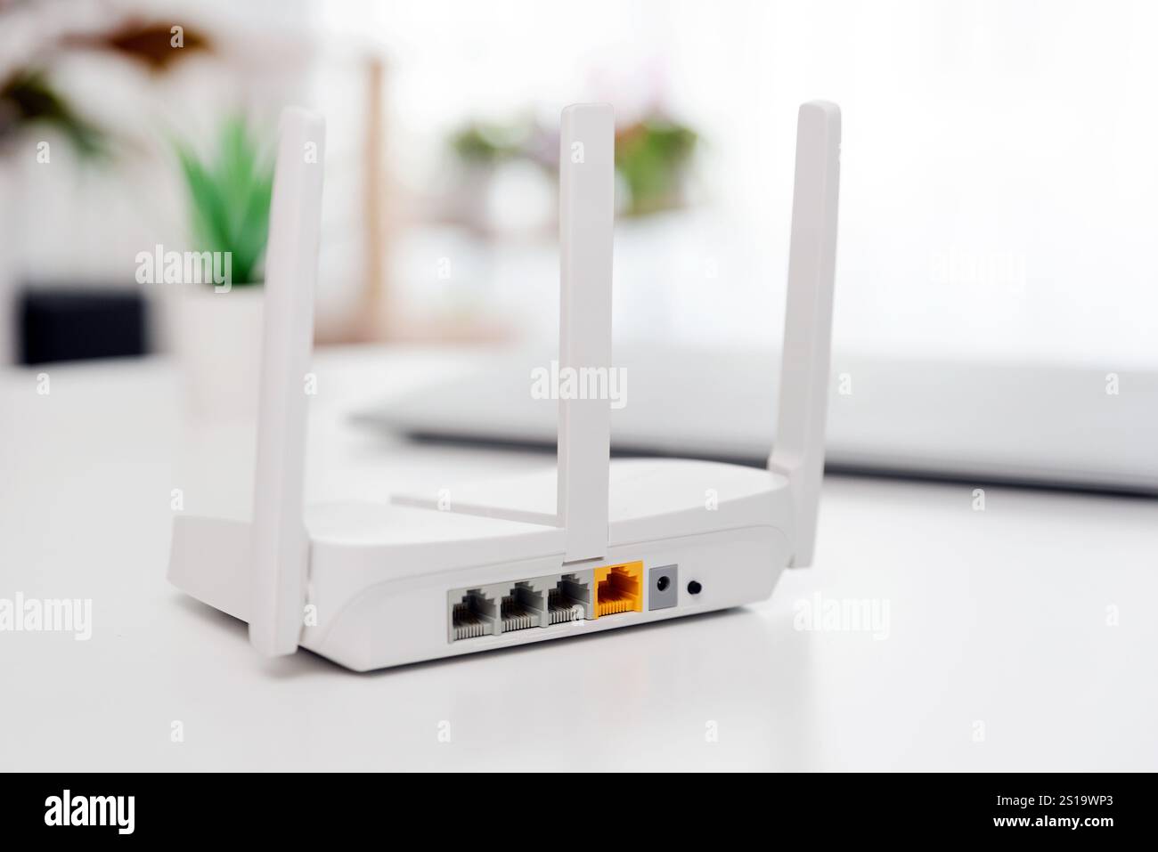 Fast internet at home concept with modern WiFi router Stock Photo - Alamy
