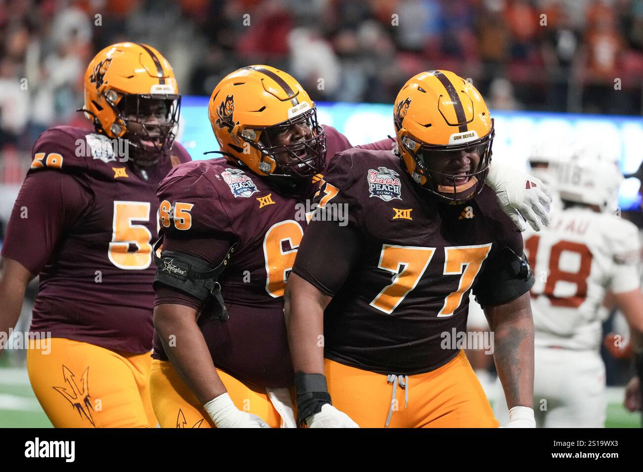 Arizona State offensive lineman Kyle Scott (77) Josh Atkins (65) and ...