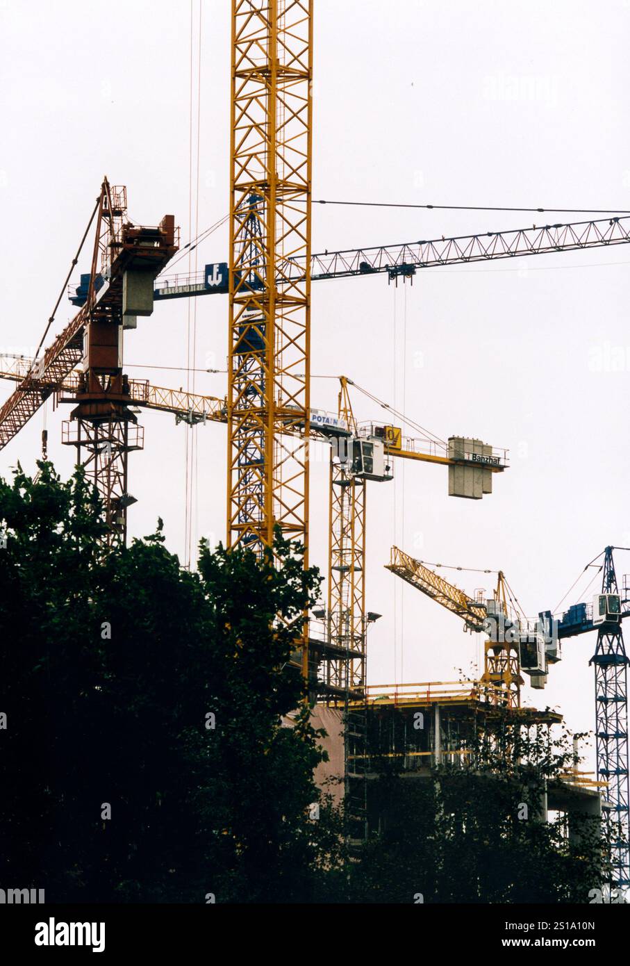Construction cranes against the sky in Berlin Stock Photo - Alamy