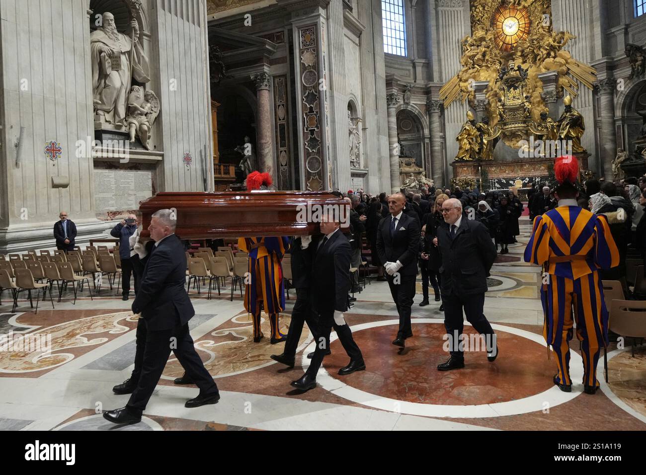 The coffin of late cardinal Angelo Amato is carried after the funeral ...
