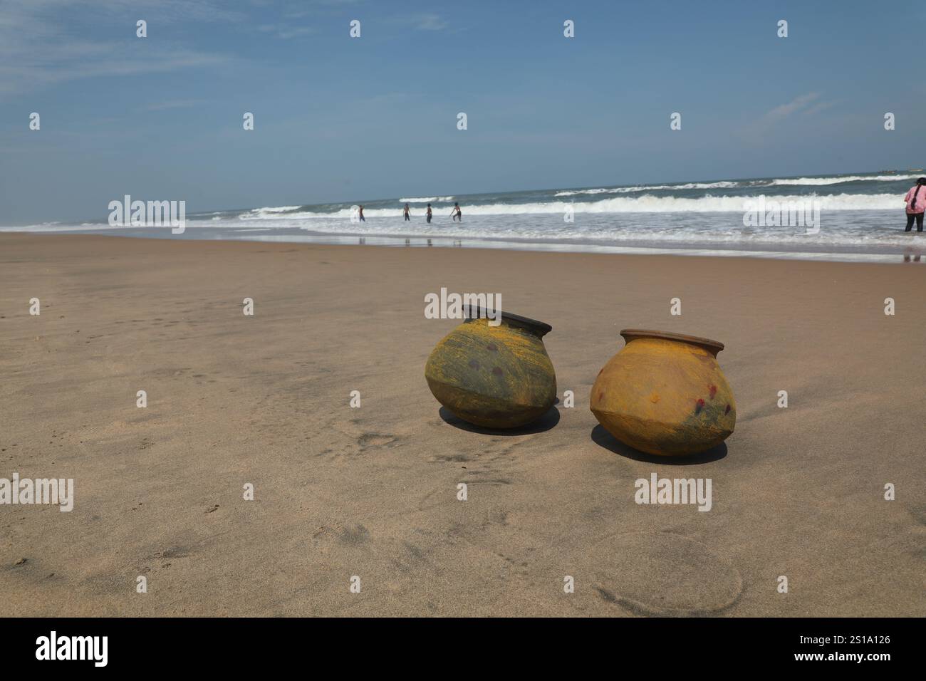 Pots on the Beach sand Stock Photo - Alamy