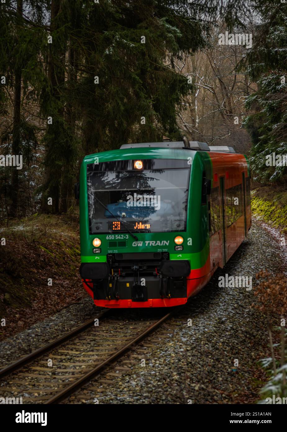 Color private passenger train in winter forest near Lcovice stop CZ 12 ...