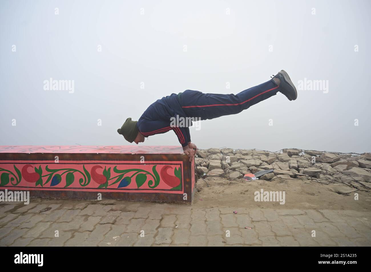 Prayagraj, Uttar Pradesh, India. 2nd Jan, 2025. A youth performing Yoga ...