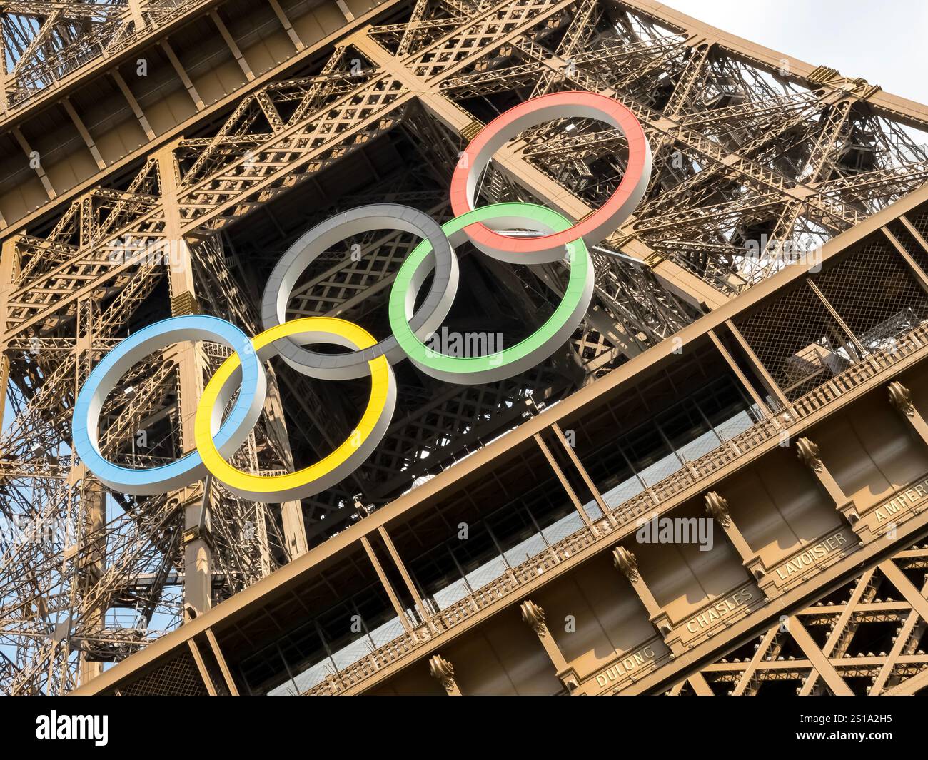 The Eiffel Tower in Paris, adorned with the Olympic rings, shines as a ...
