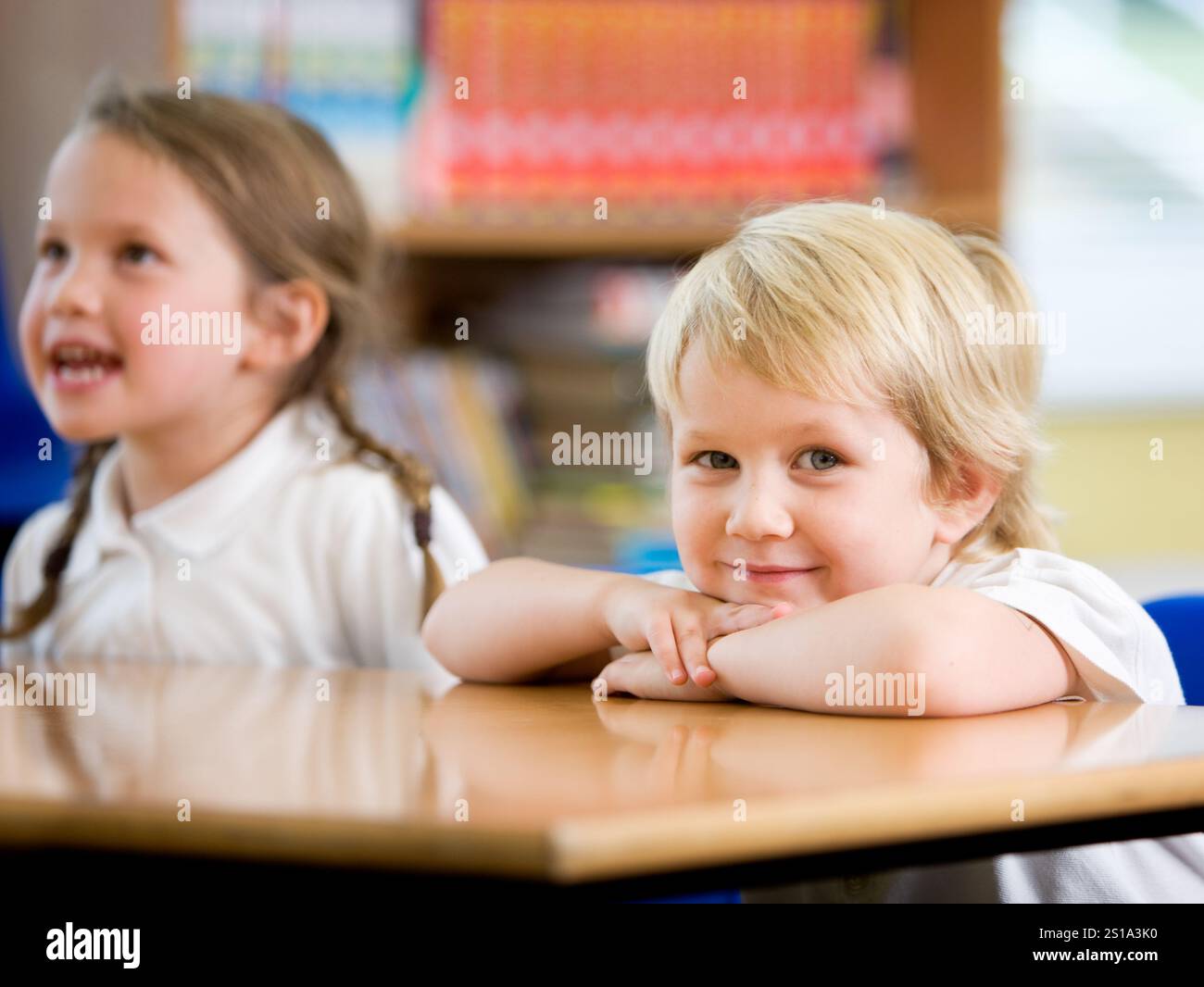 Elementary School: Enjoying Class. A smile and a glance to the camera ...