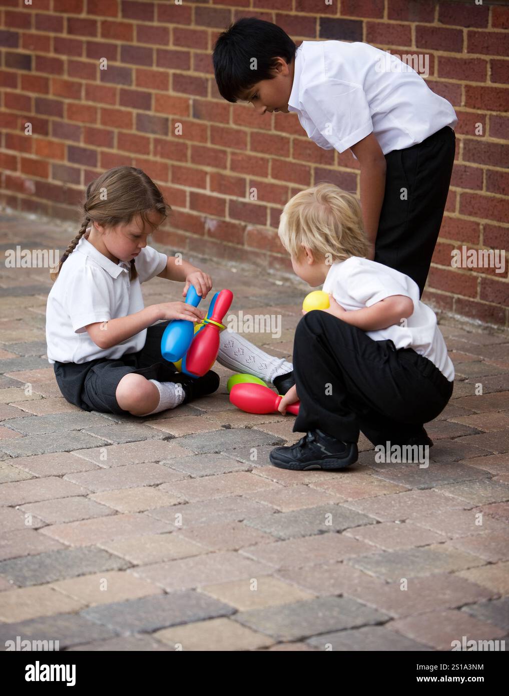 Elementary School: Playing Together. A group of primary age children ...