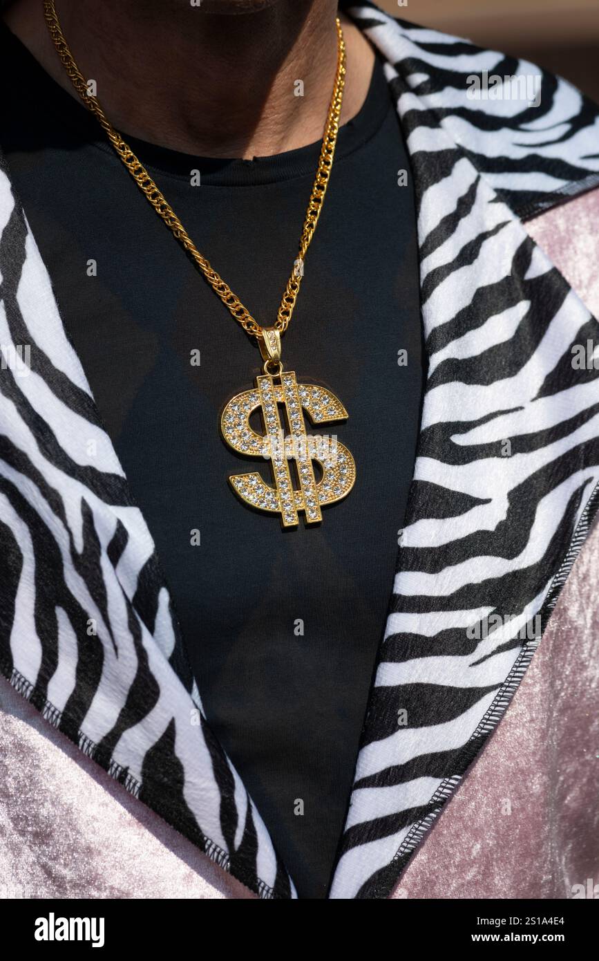 Man Wearing Dollar Sign Necklace Stock Photo - Alamy