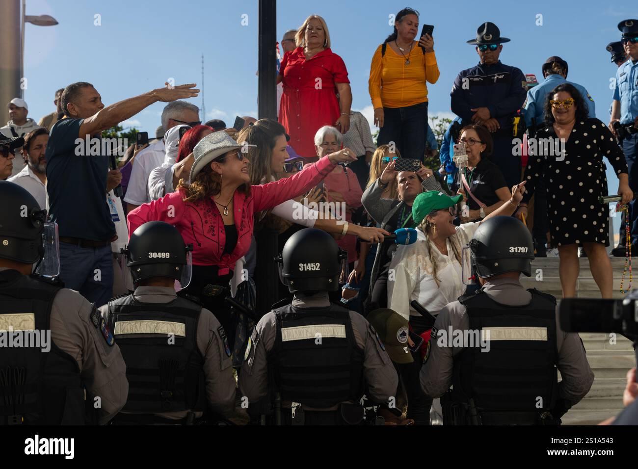San Juan, USA. 02nd Jan, 2025. Environmental activists face off with ...