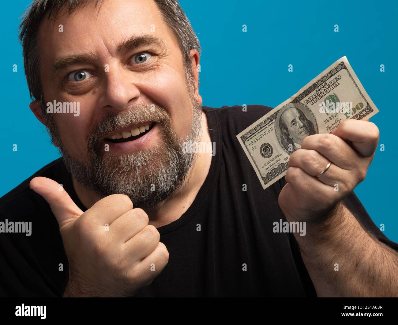Enthusiastic individual shows excitement by giving a thumbs-up while ...