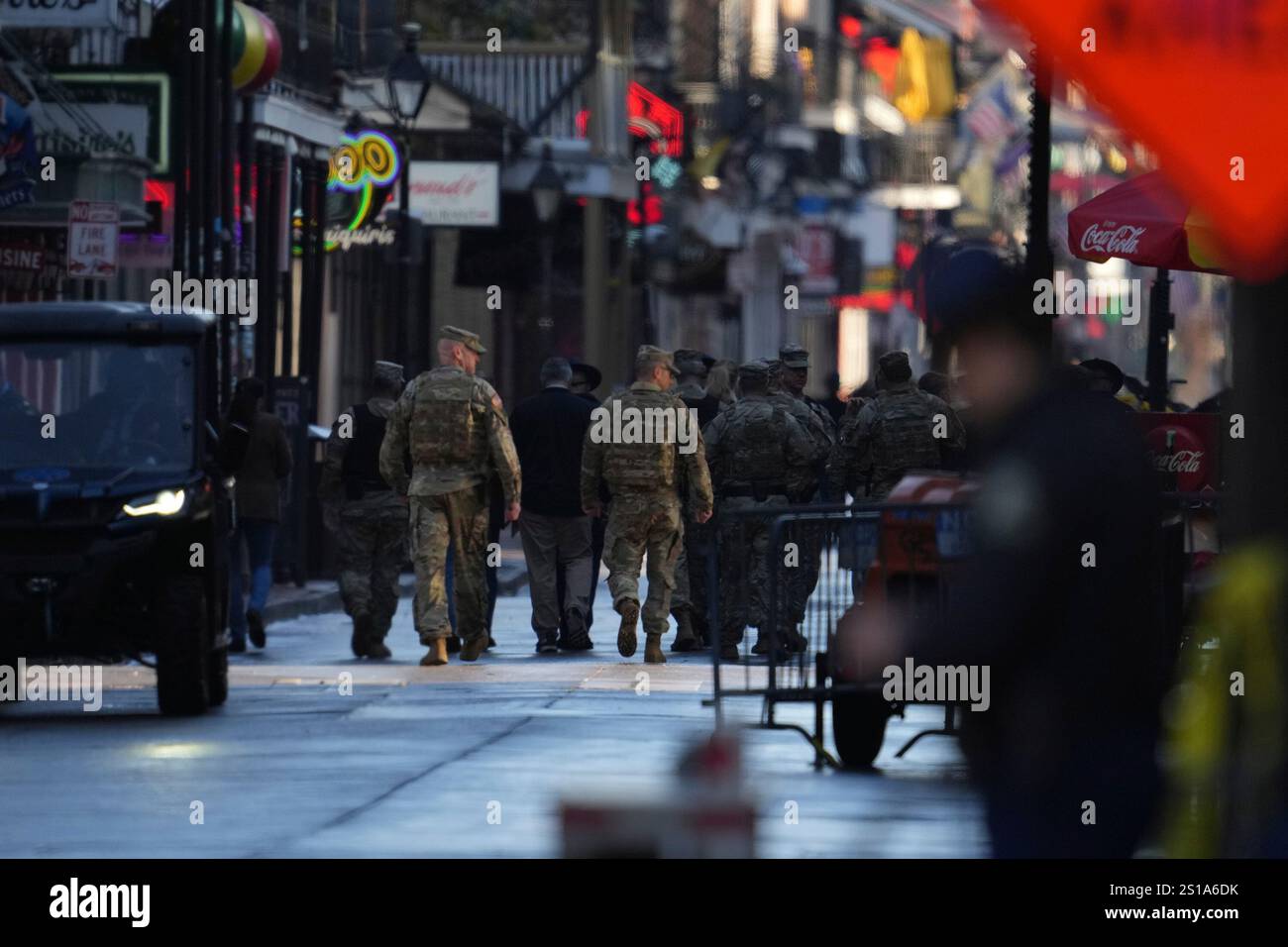 Military personnel walk down Bourbon street, Thursday, Jan. 2, 2025 in ...