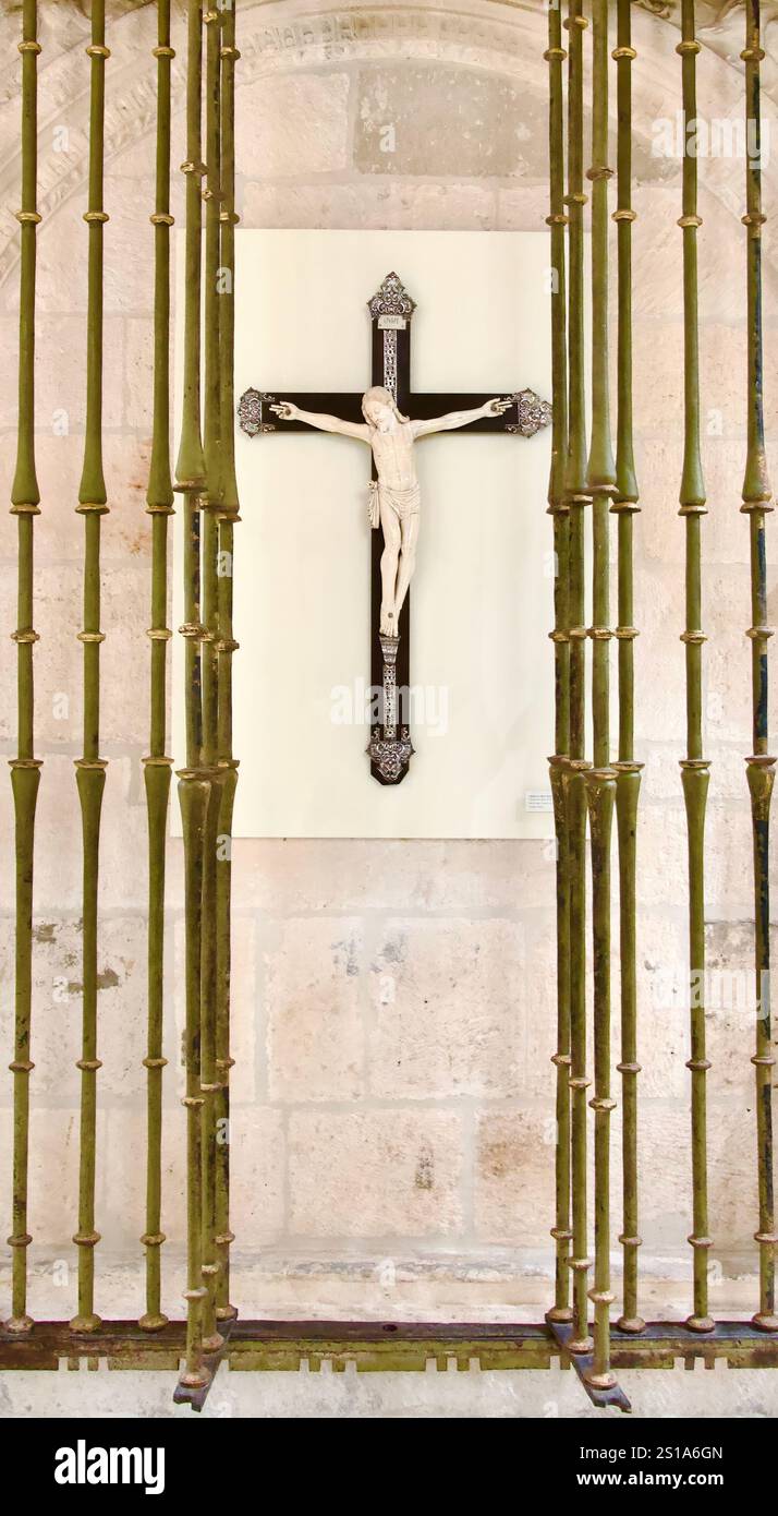 Sculpture of Jesus Christ on a cross on a wall in a gallery in the ...