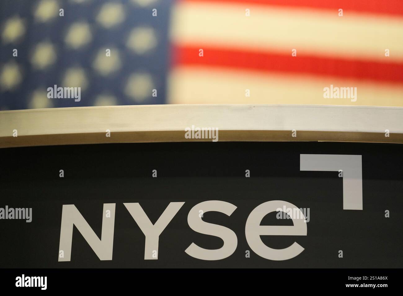 An NYSE sign is displayed on the floor at the New York Stock Exchange ...