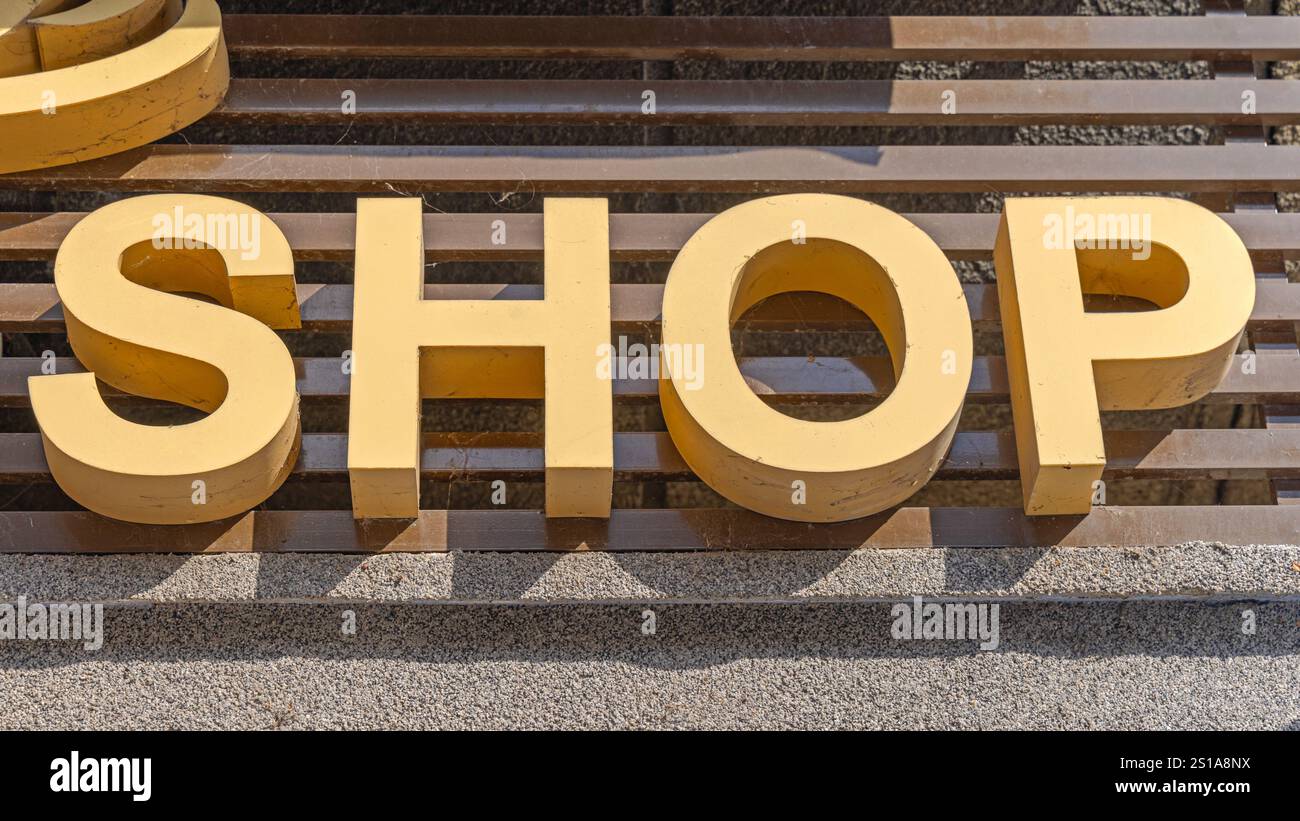 3d Sign Yellow Letters Shop at Wood Planks Background Stock Photo - Alamy