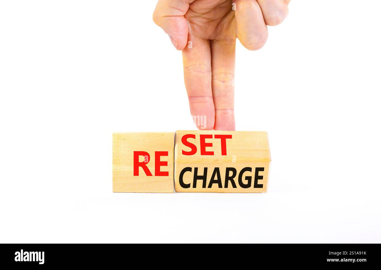 Reset and recharge symbol. Concept words Reset Recharge on beautiful wooden block. Beautiful ...