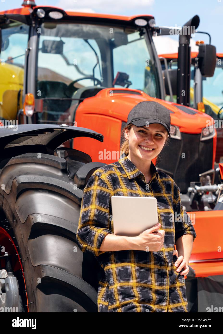 Agricultural or Construction equipment dealer. Woman with digital table ...