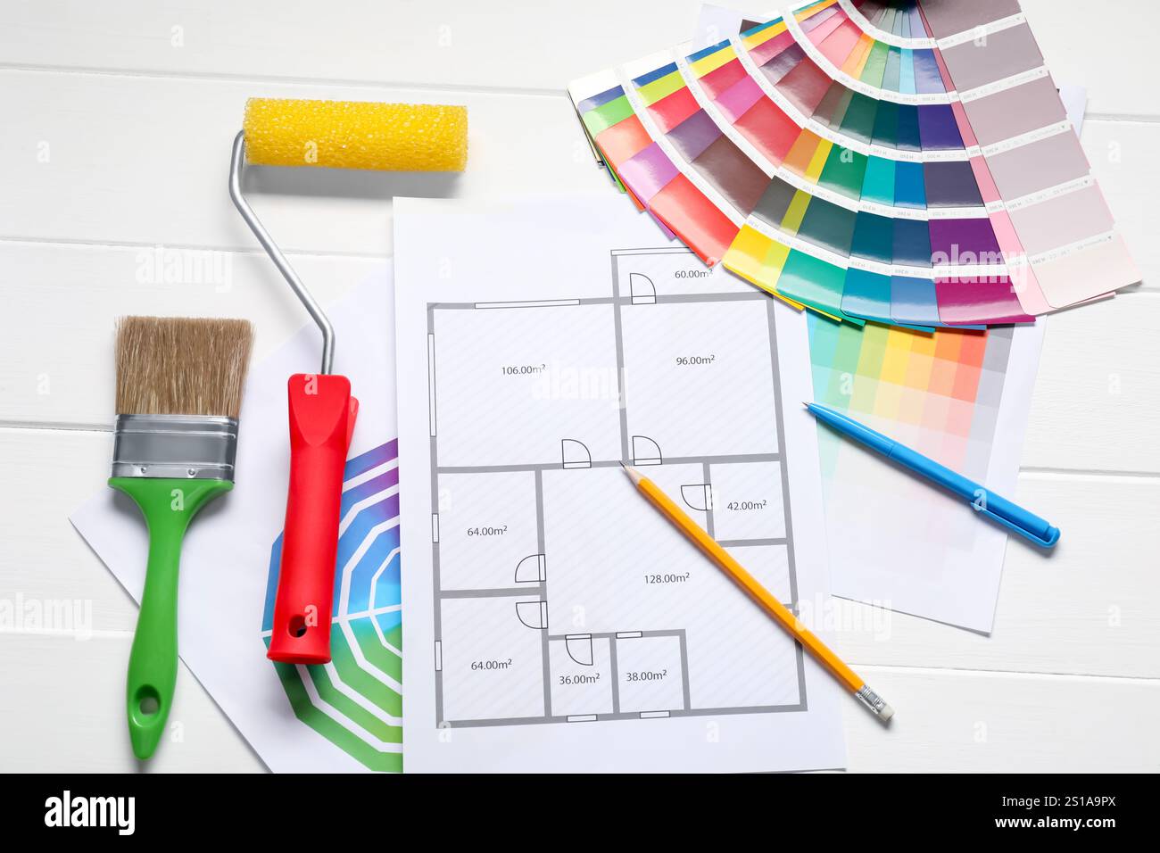 Designer's workplace with color palettes, floor plan and different ...