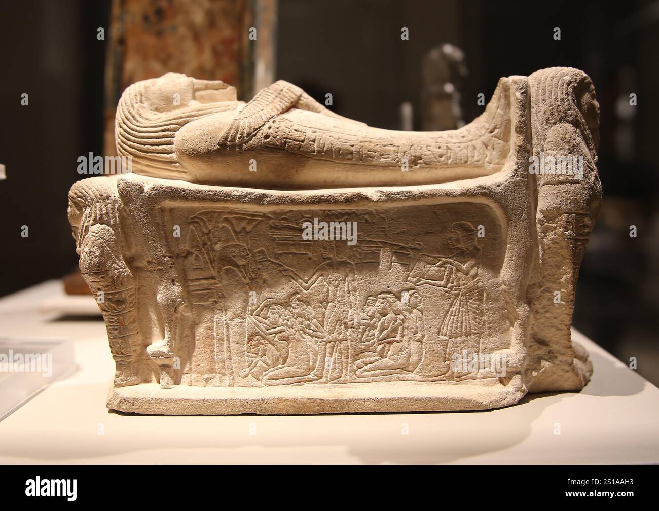 Mummy on a beer with shabtis. A funeral is depicted on one side, the ...