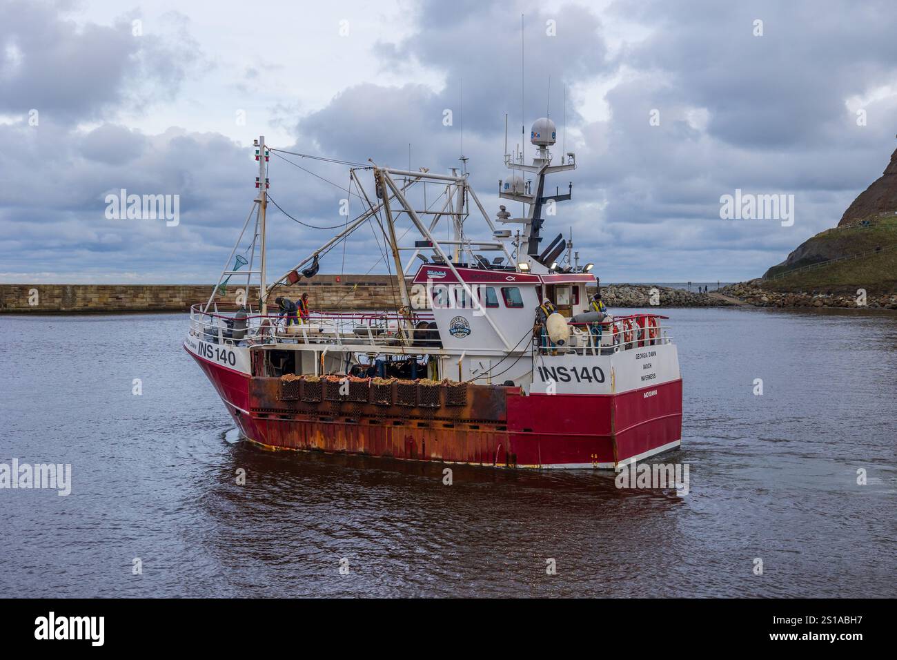 Georgia Dawn, a fishing boat, leaving Whitby, a popular seaside town on ...