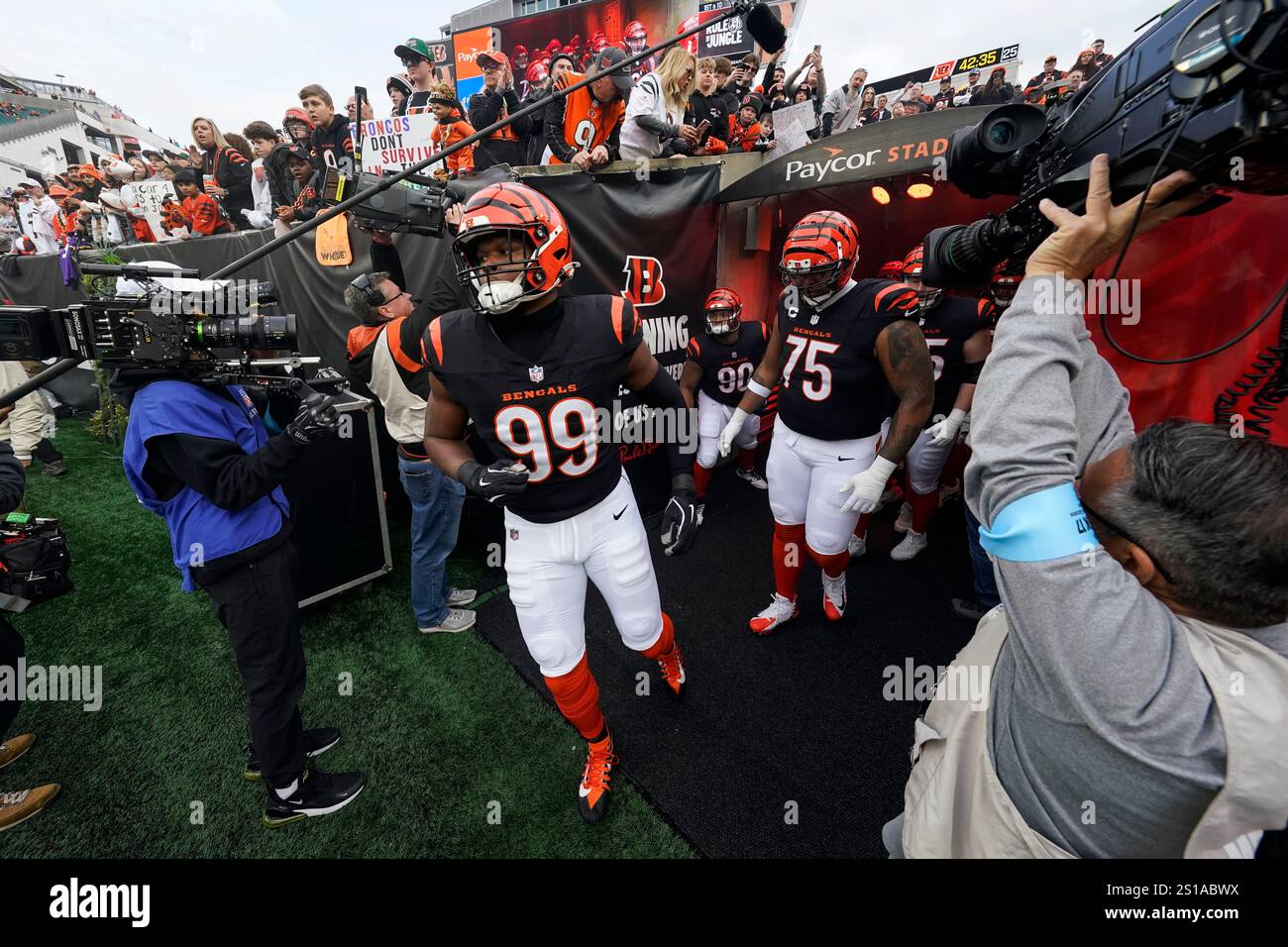 Cincinnati Bengals' Myles Murphy (99) runs out of the tunnel with ...