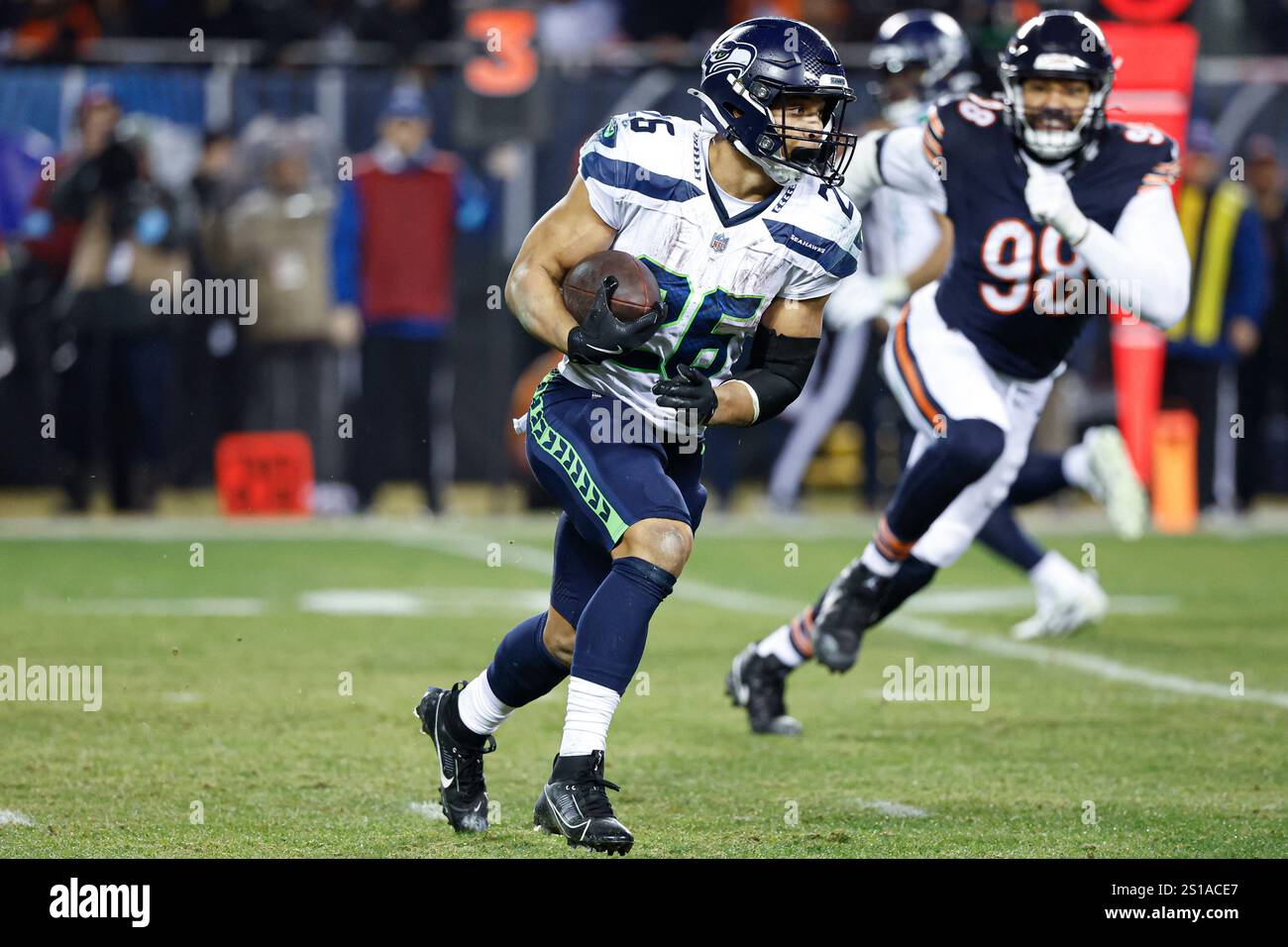 Seattle Seahawks running back Zach Charbonnet (26) runs with the ball ...