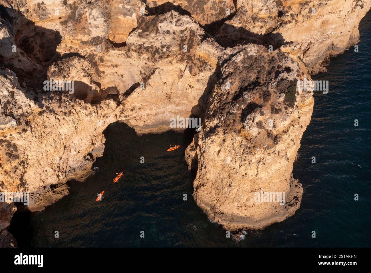 Portugal, Algarve, Lagos, tour by kayak of the caves in the steep ...