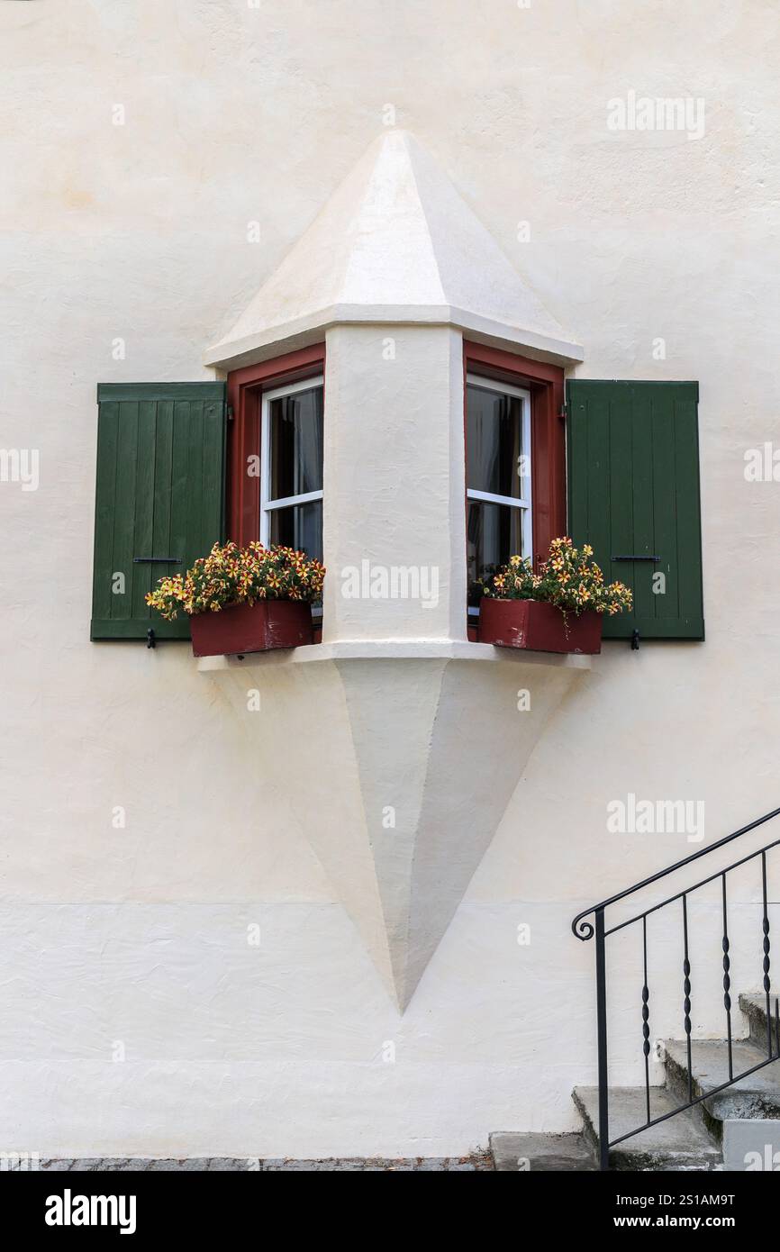 Typical traditional house windows style in triangle form enables to ...