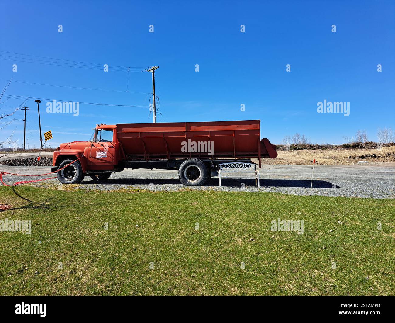 Red company truck parked at the Covered Bridge Potato Chip factory on ...