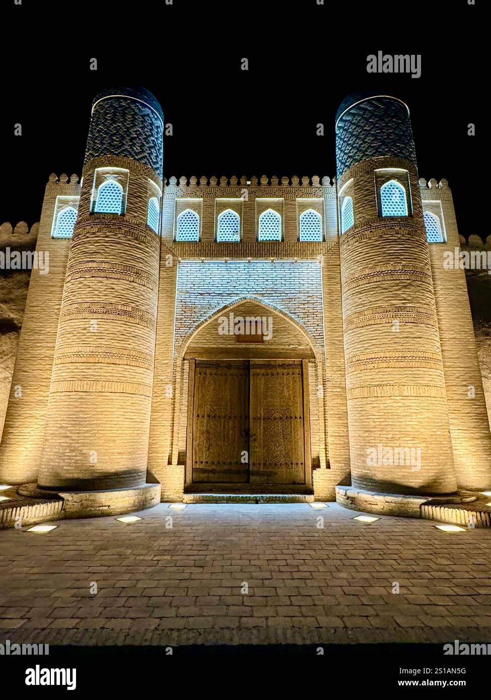 Illuminated Historic Gate with Twin Towers and Intricate Details Stock ...