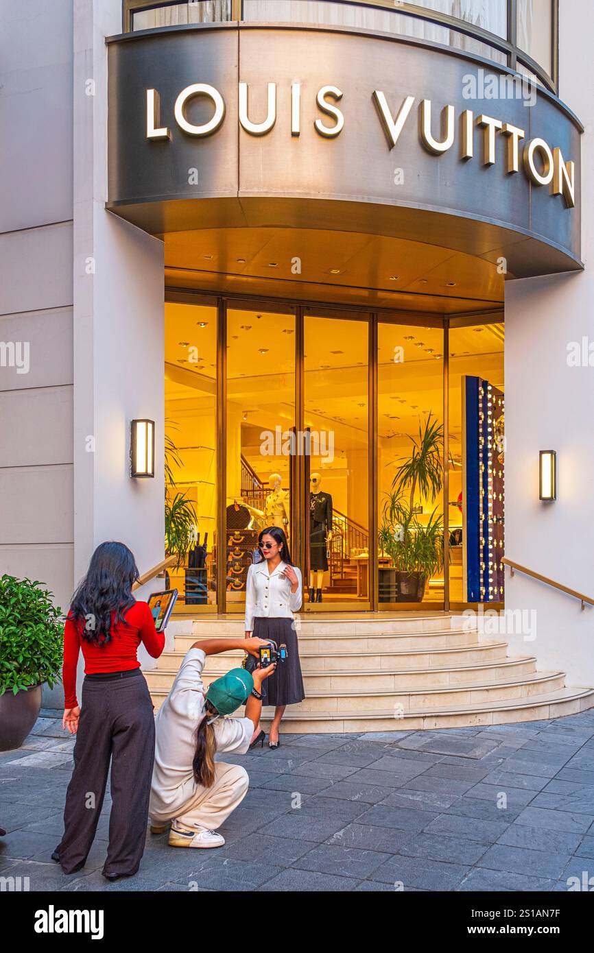 Vietnam, Hanoi, district of Hoan Kiem, former French colonial district, model posing in front of ...