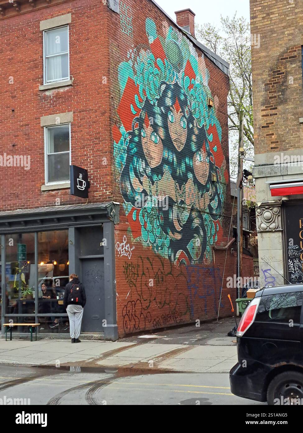 Portrait of three women mural in an alley near Saint-Laurent Boulevard ...