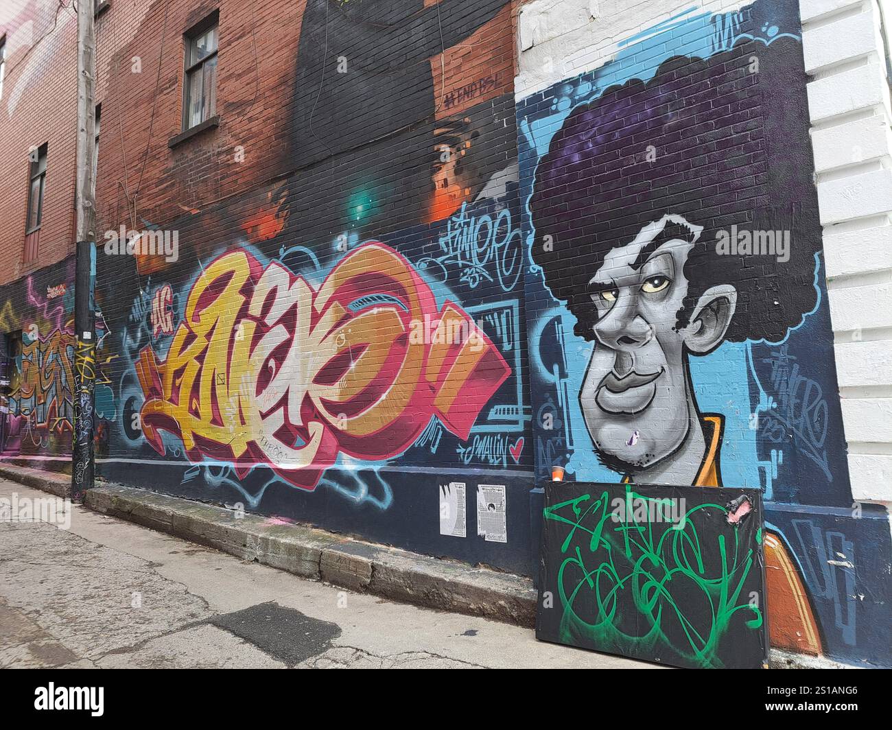 Black cartoon character mural in an alley near Saint-Laurent Boulevard ...