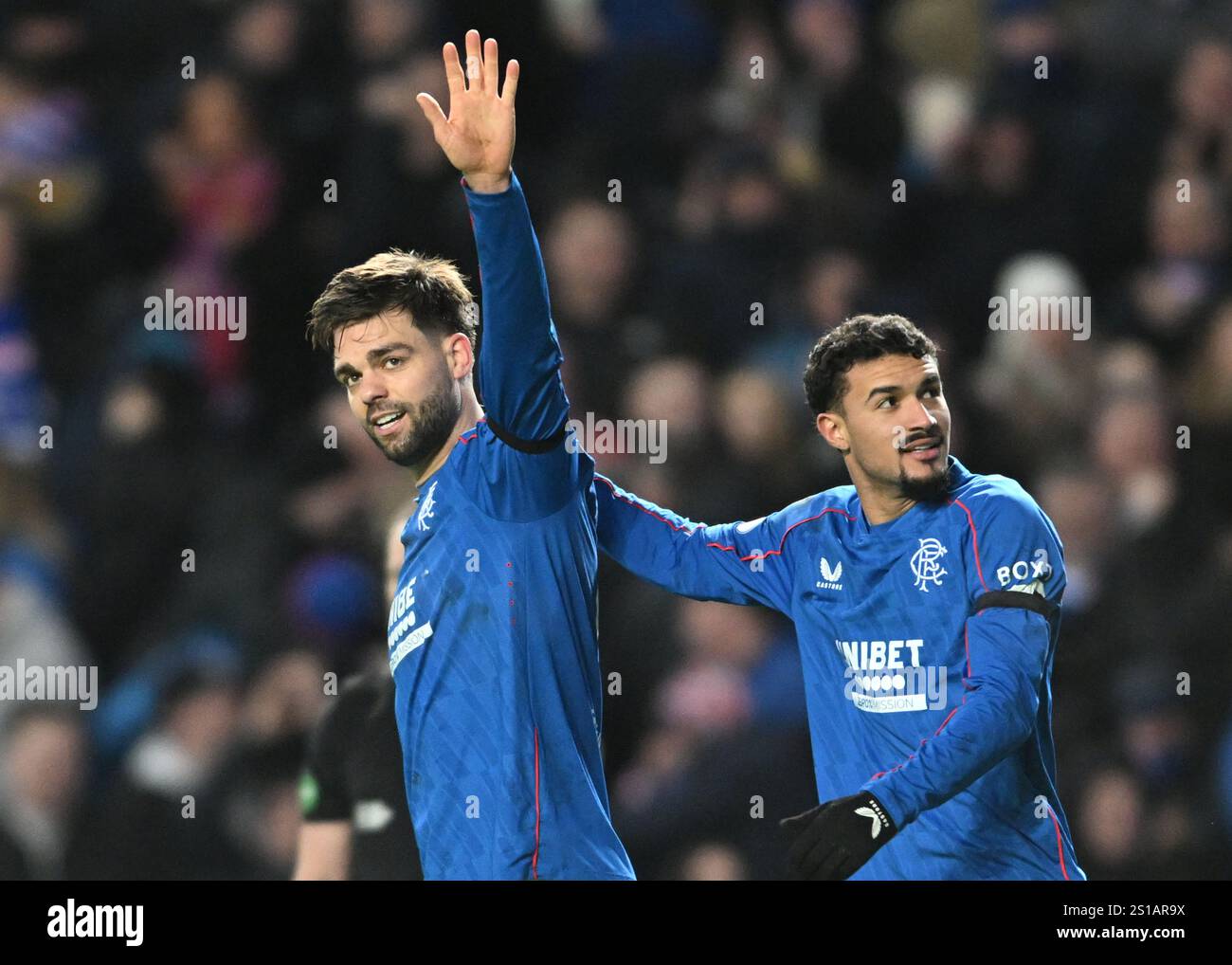 Glasgow, UK. 2nd Jan, 2025. Robin Pröpper of Rangers (left) celebrates ...