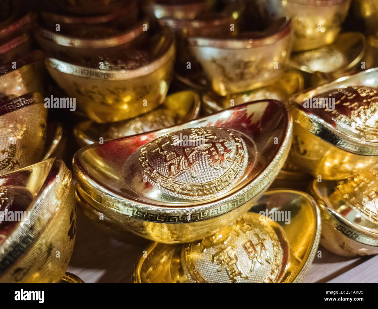 A pile of decorative gold ingots for Chinese New Year Stock Photo - Alamy