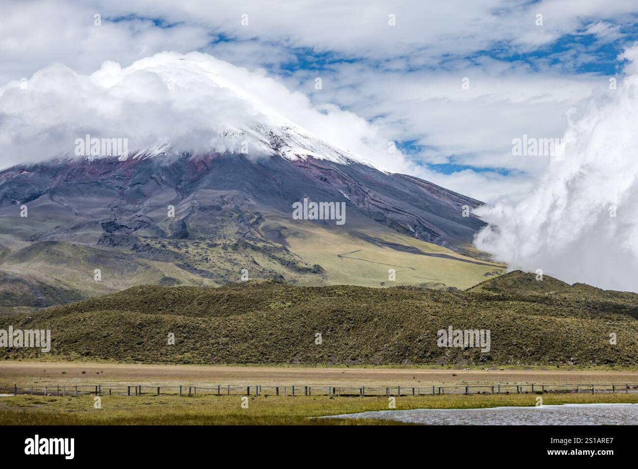 Cotopaxi volcano peak shrouded in cloud, Limpiopungo lagoon or lake ...