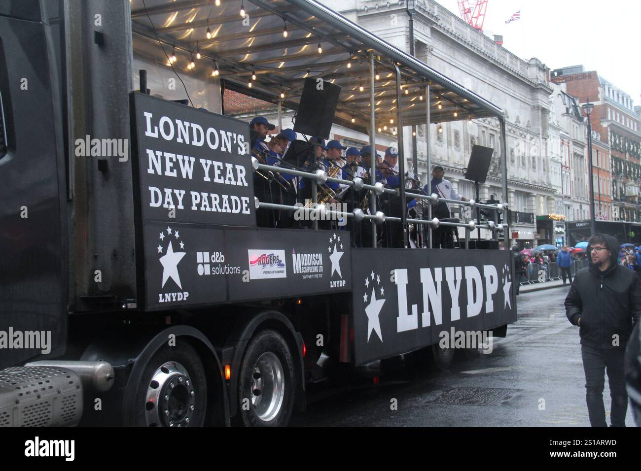 A parade float with a live band is driven along the parade route. ?The ...