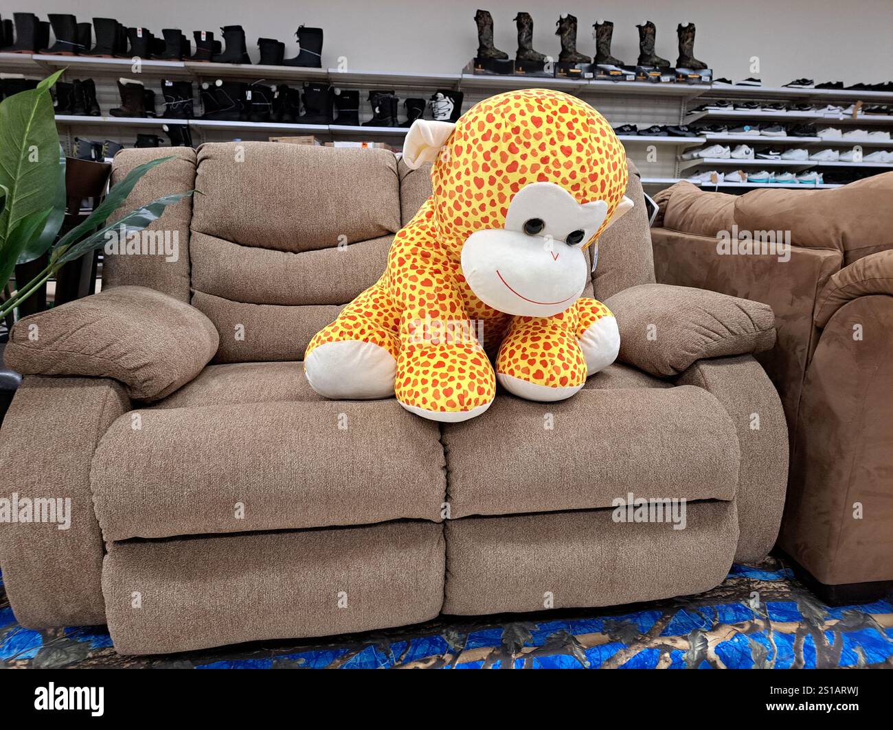 Stuffed monkey on a couch at North Mart department grocery store on ...