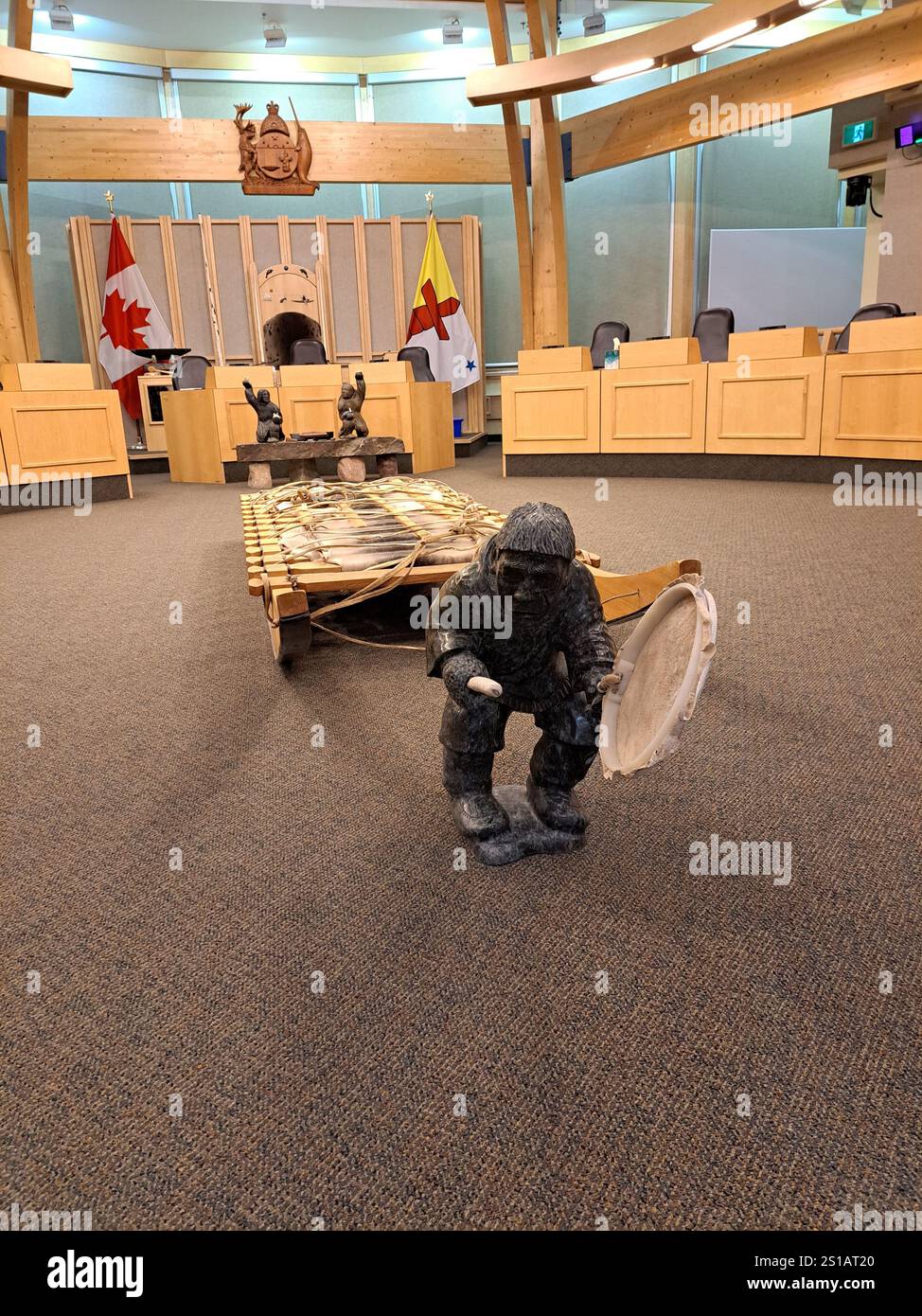 Inuit stone sculpture figurine pulling a qamutiik in the chambers at ...